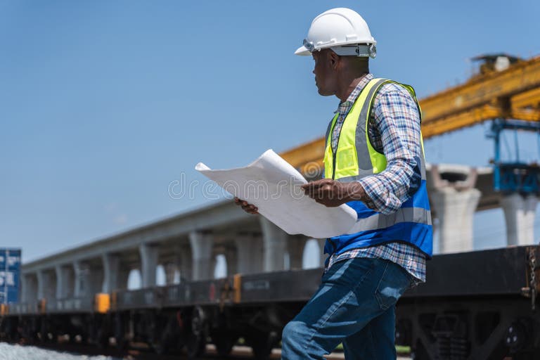 Construction Engineer Reviewing Blueprints at Site, Professional Worker ...