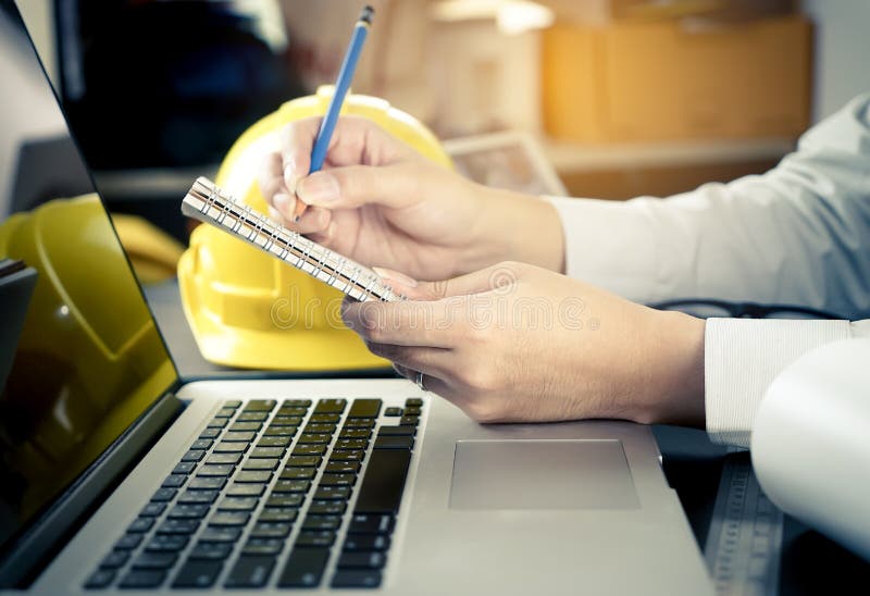 Engineer is Taking Note on a Desk Full of Construction Stock Image ...