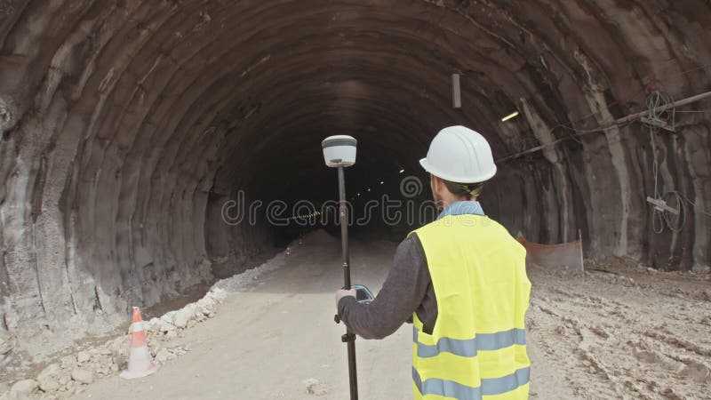 Construction Engineer Using a GPS Device for Measurements in a Large ...