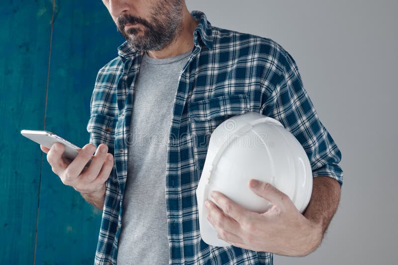 Engineer with mobile phone stock image. Image of phone - 10776527