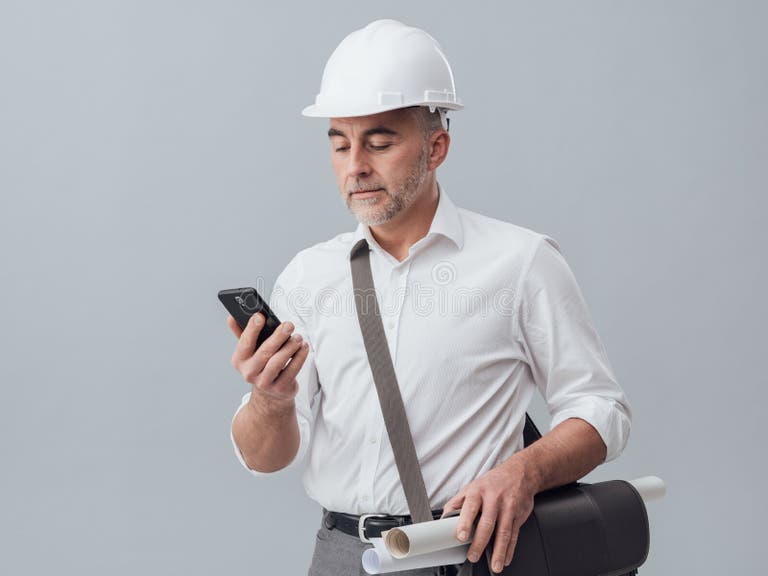 Construction Engineer Using a Smartphone Stock Photo - Image of manager ...