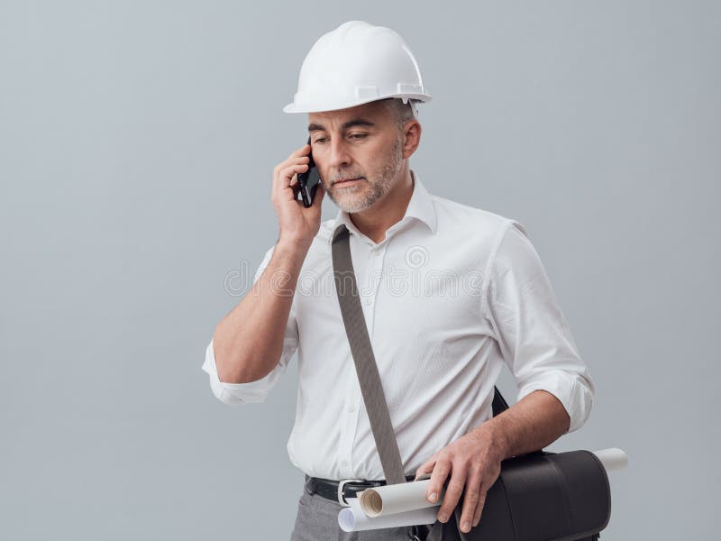 Construction Engineer Using a Smartphone Stock Photo - Image of ...