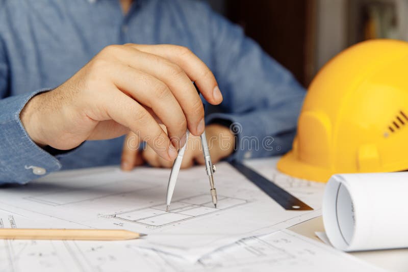 Construction Engineer Working on Blueprint Architectural Project at ...