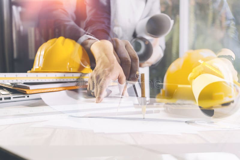 Construction Engineer Working at Blueprint To Build Large Commercial ...