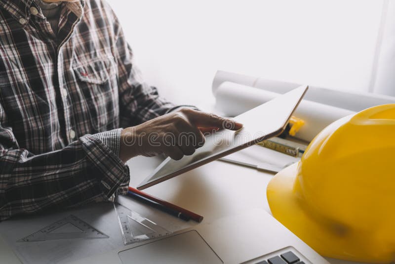 Construction Engineer Working at Blueprint To Build Large Commercial ...