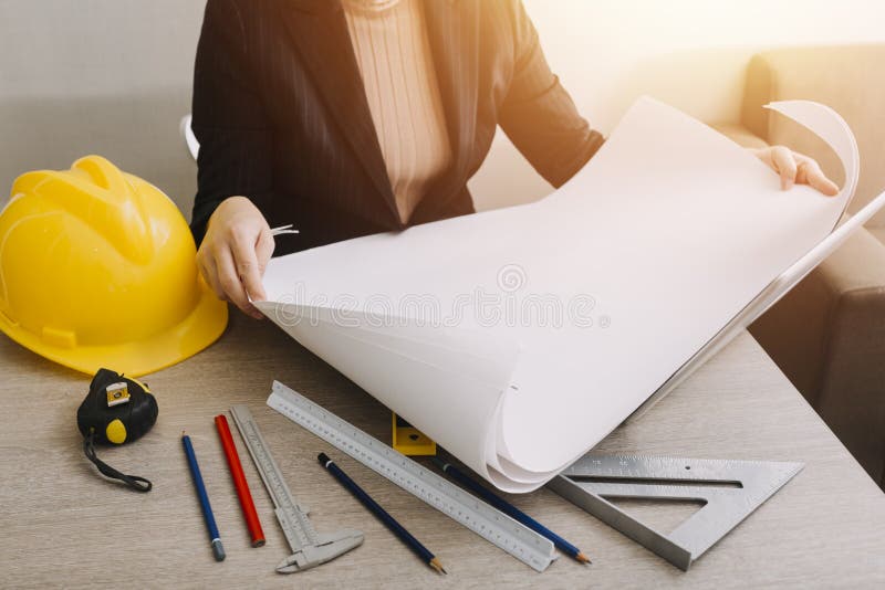 Construction Engineer Working at Blueprint To Build Large Commercial ...