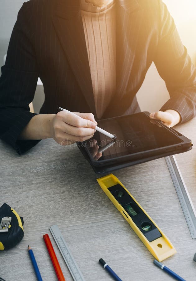 Construction Engineer Working at Blueprint To Build Large Commercial ...