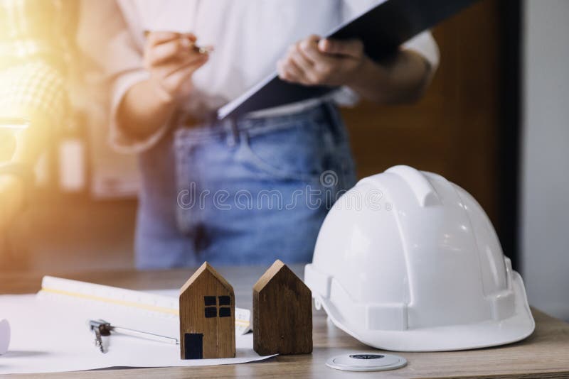 Construction Engineer Working at Blueprint To Build Large Commercial ...