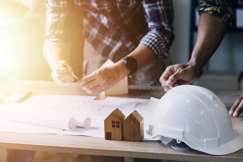 Construction Engineer Working at Blueprint To Build Large Commercial ...