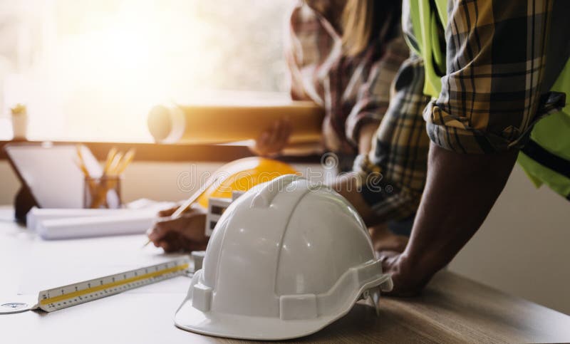 Construction Engineer Working at Blueprint To Build Large Commercial ...