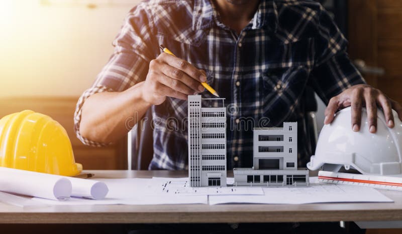 Construction Engineer Working at Blueprint To Build Large Commercial ...