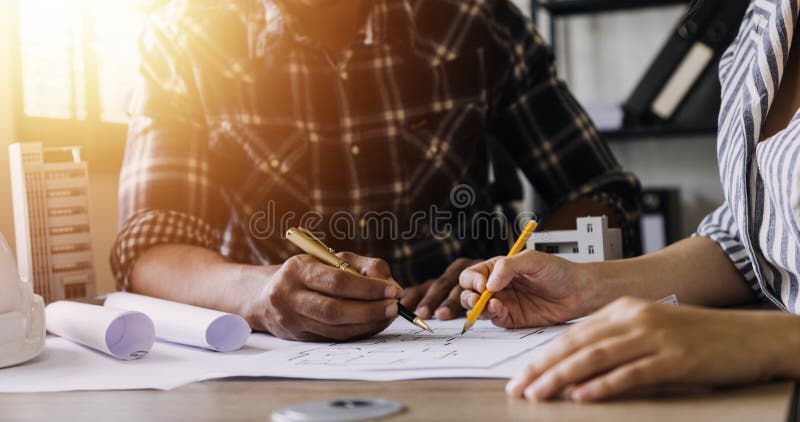 Construction Engineer Working at Blueprint To Build Large Commercial ...