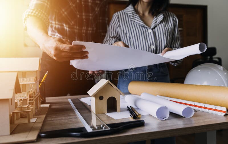 Construction Engineer Working at Blueprint To Build Large Commercial ...