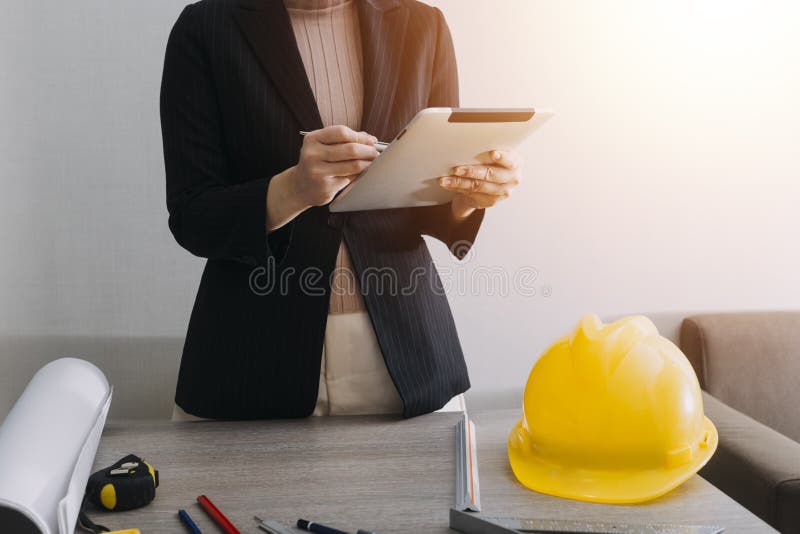 Construction Engineer Working at Blueprint To Build Large Commercial ...