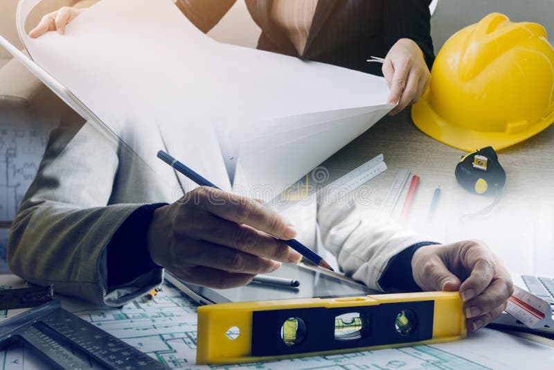 Construction Engineer Working at Blueprint To Build Large Commercial ...