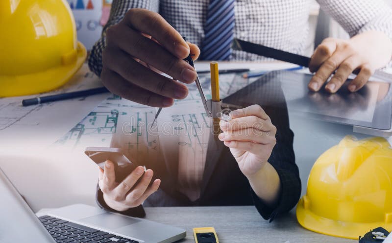 Construction Engineer Working at Blueprint To Build Large Commercial ...