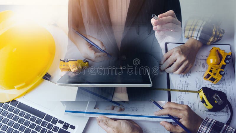 Construction Engineer Working at Blueprint To Build Large Commercial ...