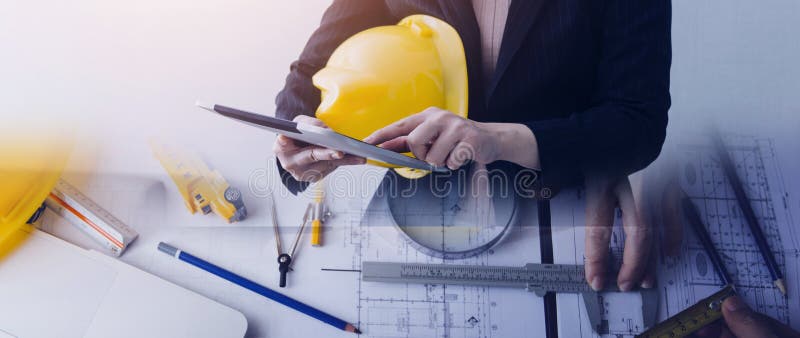 Construction Engineer Working at Blueprint To Build Large Commercial ...