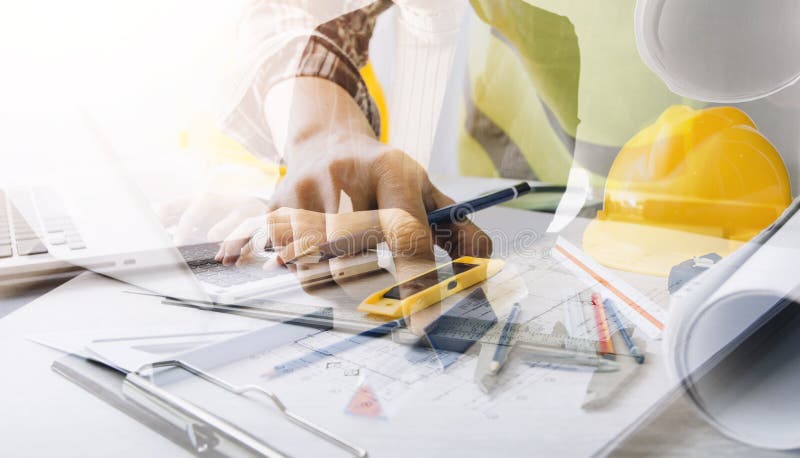 Construction Engineer Working at Blueprint To Build Large Commercial ...