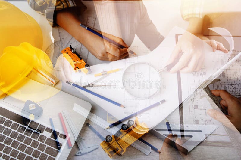 Construction Engineer Working at Blueprint To Build Large Commercial ...