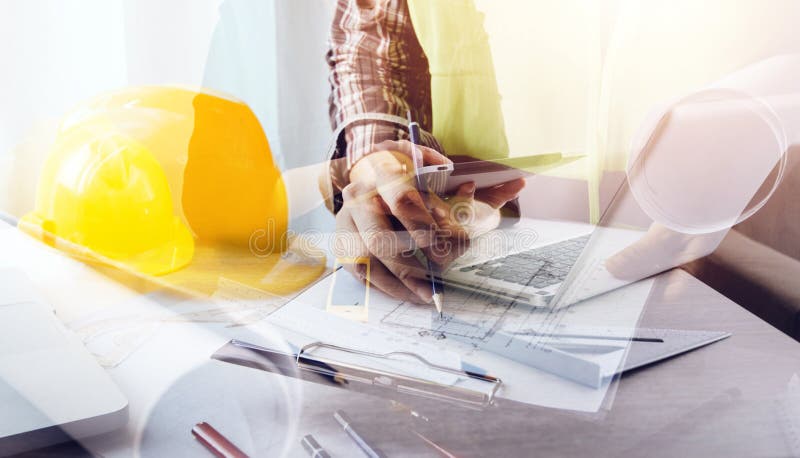 Construction Engineer Working at Blueprint To Build Large Commercial ...