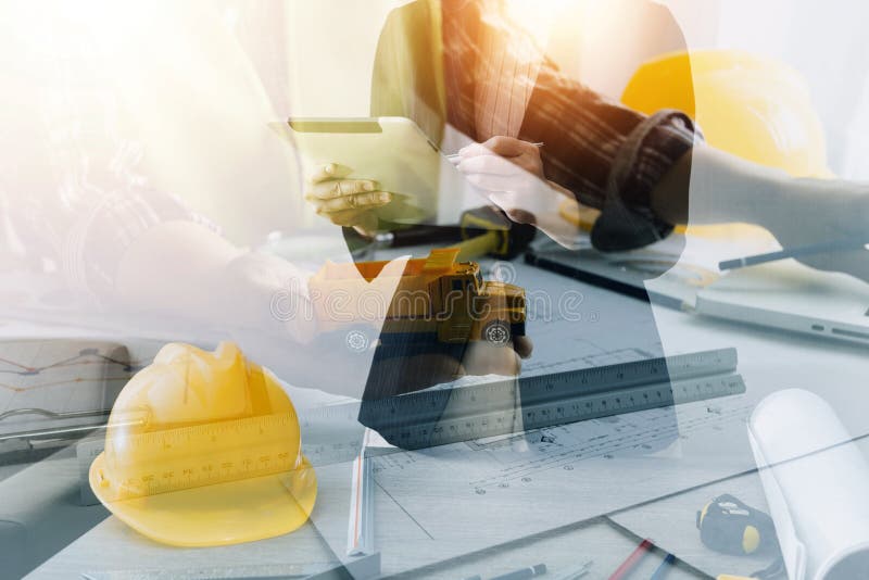 Construction Engineer Working at Blueprint To Build Large Commercial ...