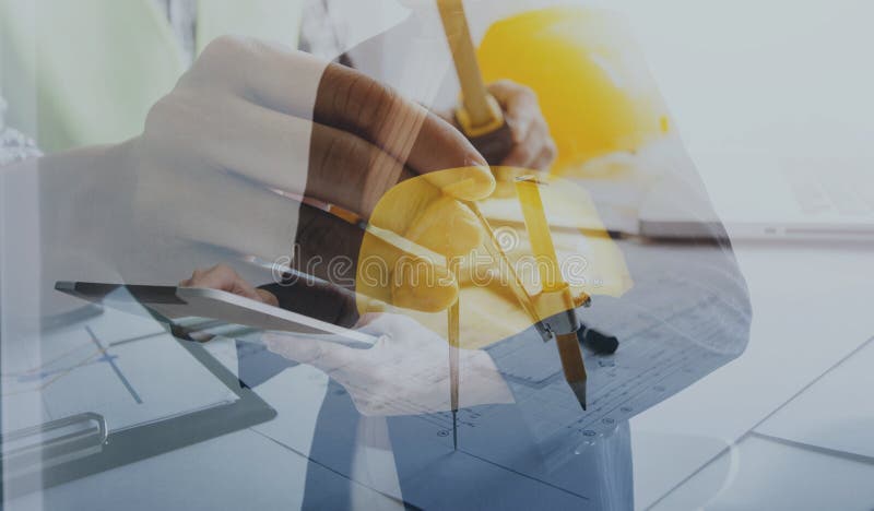 Construction Engineer Working at Blueprint To Build Large Commercial ...