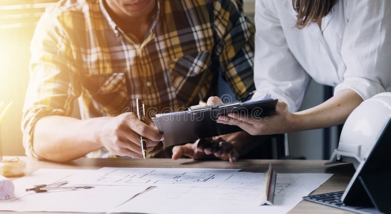 Construction Engineer Working at Blueprint To Build Large Commercial ...