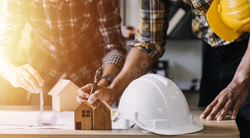 Construction Engineer Working at Blueprint To Build Large Commercial ...