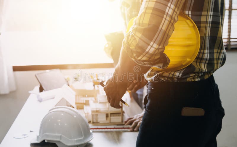 Construction Engineer Working at Blueprint To Build Large Commercial ...