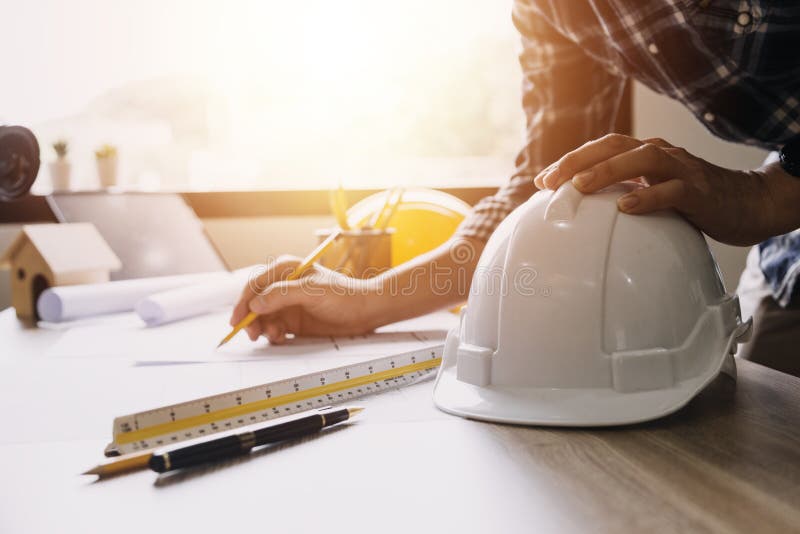 Construction Engineer Working at Blueprint To Build Large Commercial ...