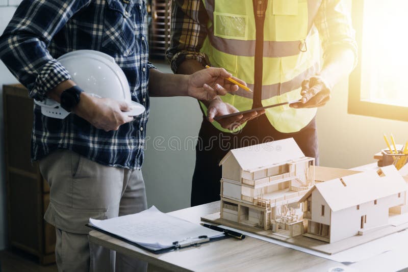 Construction Engineer Working at Blueprint To Build Large Commercial ...