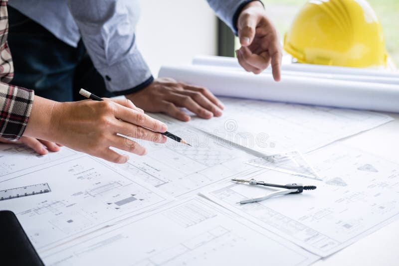 Construction Engineering or Architect Discuss a Blueprint while ...