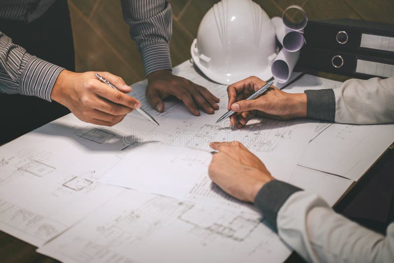 Construction Engineering or Architect Discuss a Blueprint while ...