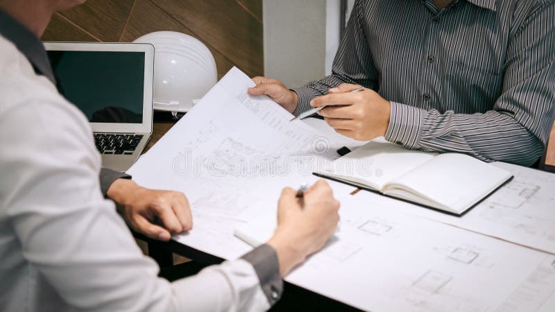Construction Engineering or Architect Discuss a Blueprint while ...
