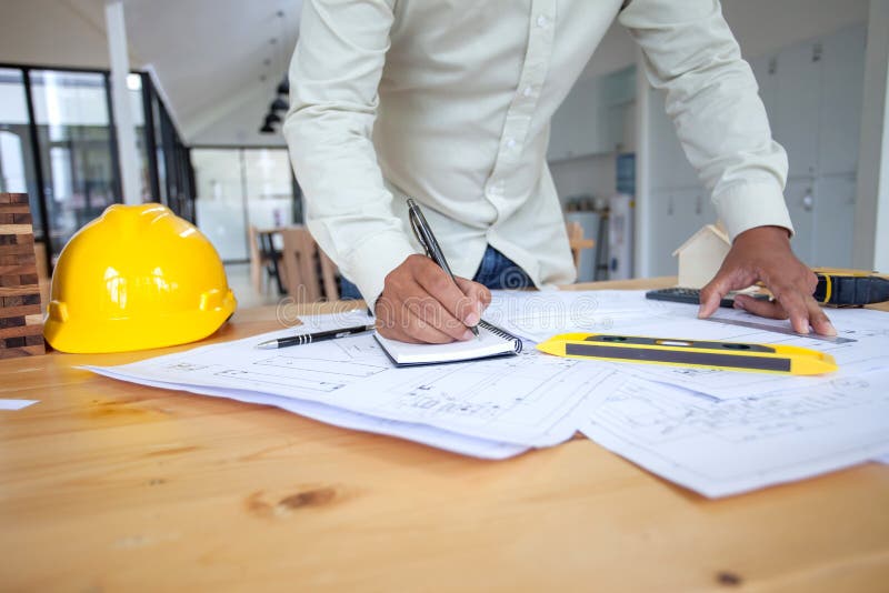 Construction Engineering. Architect Drawing Blueprints and Engineering ...