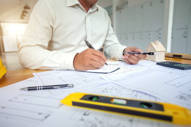 Construction Engineering. Architect Drawing Blueprints and Engineering ...