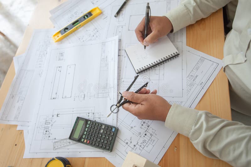 Construction Engineering. Architect Drawing Blueprints and Engineering ...