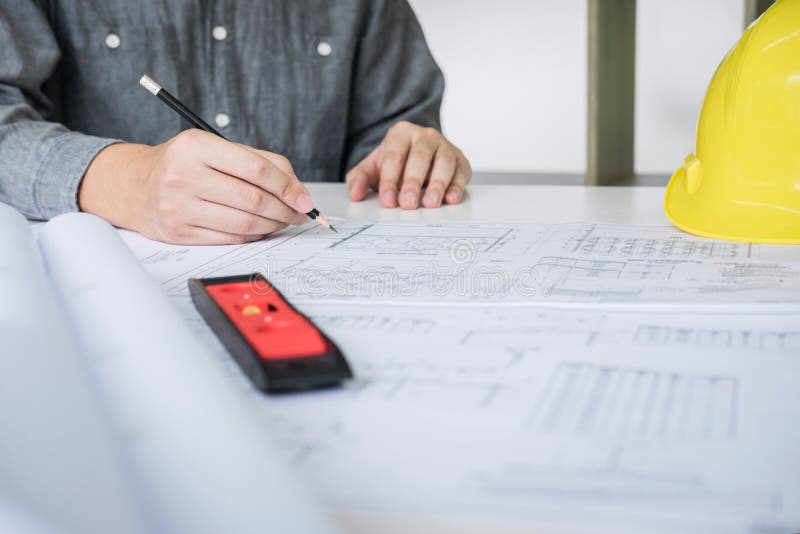 Construction Engineering or Architect Hands Working on Blueprint ...