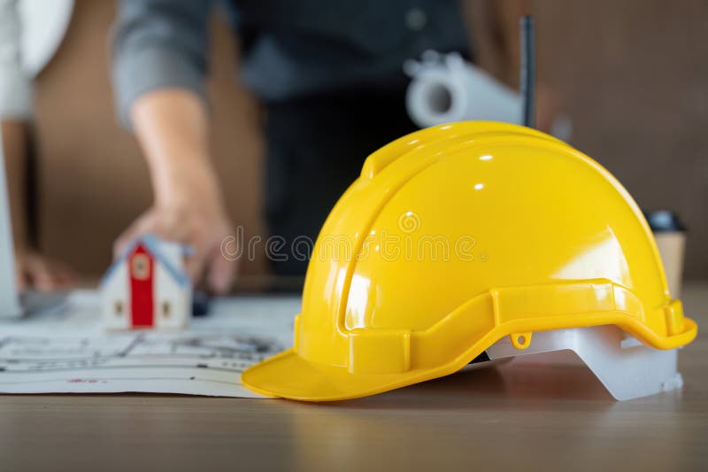 Construction and Engineering. a Yellow Hard Hat Rests on the ...