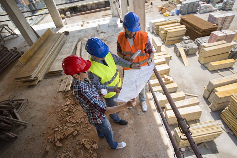 Engineers Checking Blueprint and Planning Project Working Outdoors ...