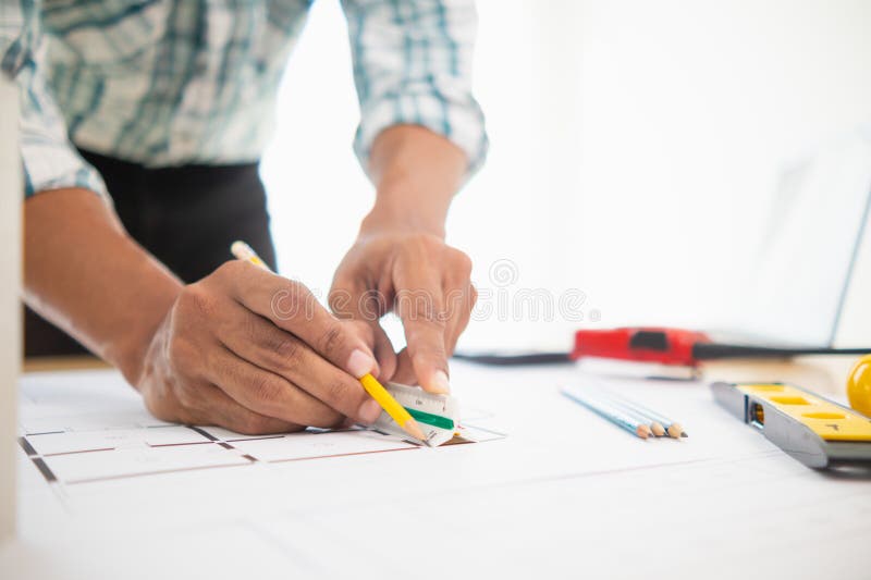 Construction Engineers are Checking Blueprints and Calculating Their ...