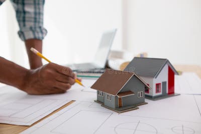 Construction Engineers are Checking Blueprints and Calculating Their ...