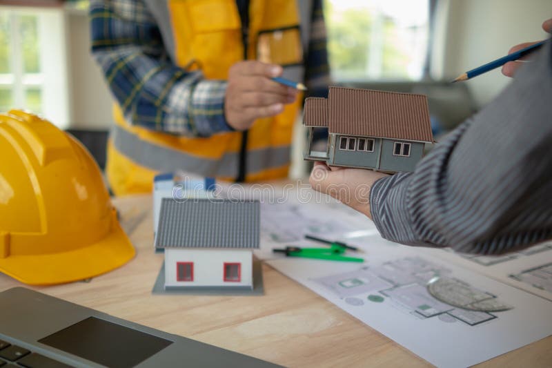 Construction Engineers Discuss and Exchange Ideas with Architects To ...