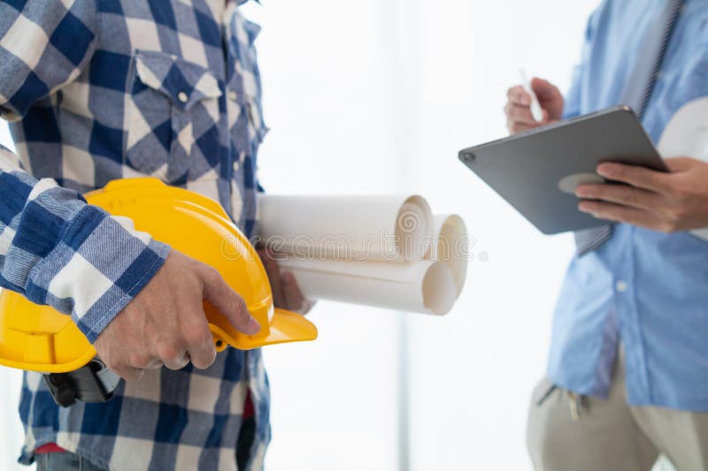 Construction Engineers Discuss and Exchange Ideas with Architects To ...