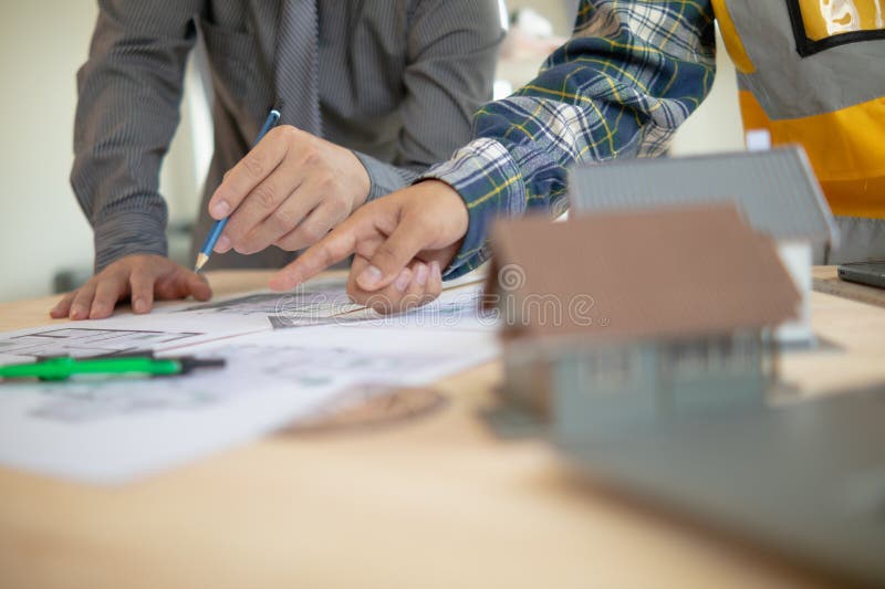 Construction Engineers Discuss and Exchange Ideas with Architects To ...
