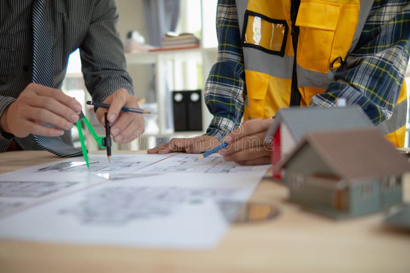 Construction Engineers Discuss and Exchange Ideas with Architects To ...