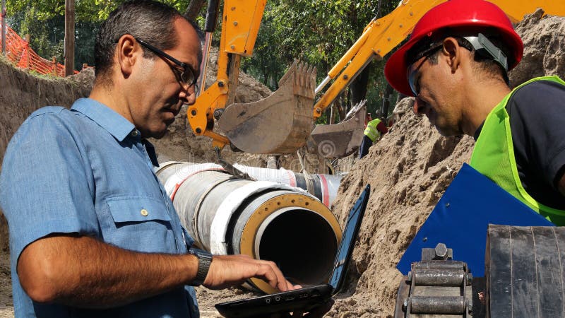 Construction Engineers Discussing Issues at Work Stock Image - Image of ...