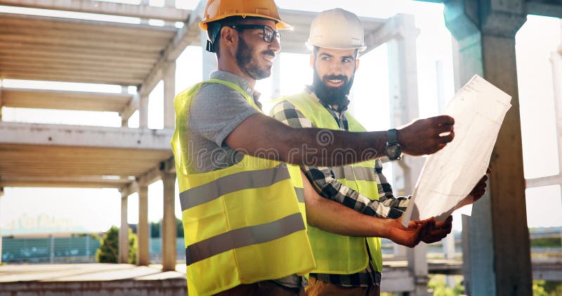 Construction Engineers Discussion with Architects at Construction Site ...