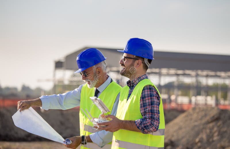 Construction Engineers with Drone at Building Site Stock Image - Image ...